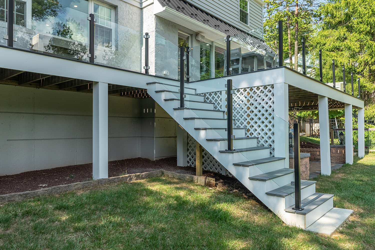 Outdoor Living Deck With Glass Panel Railing Domers Construction